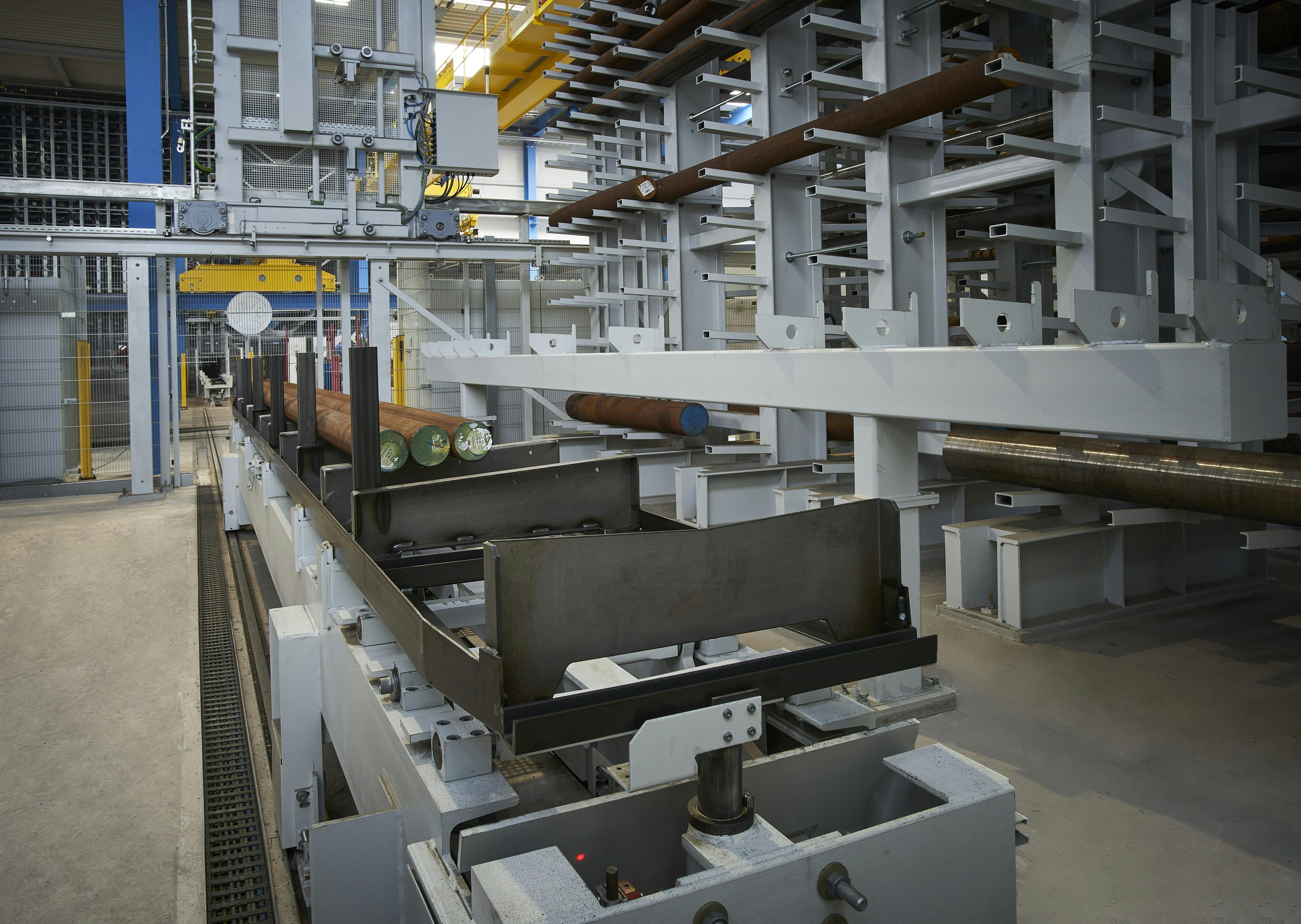 Robots, storing, cutting and palletizing for a smaller footprint ...